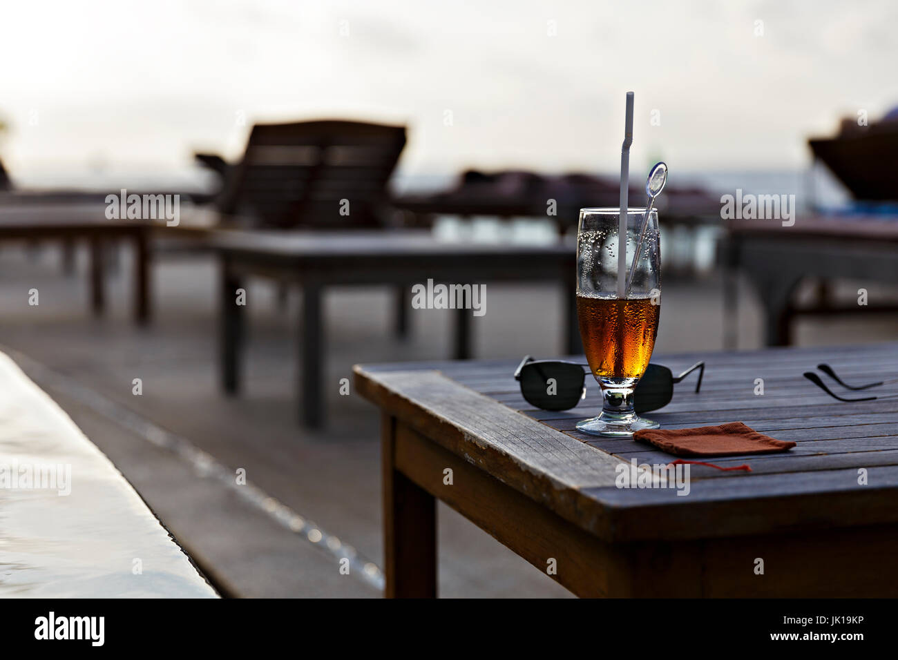 glass of beer on a table at the pool Stock Photo - Alamy