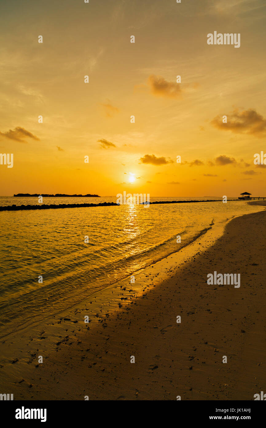 Beautiful tropical sunset on the beach Stock Photo - Alamy