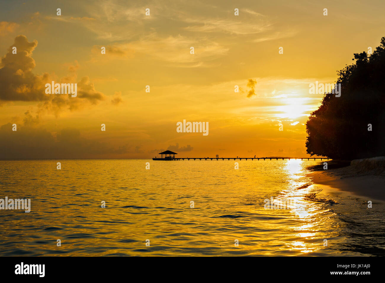 Beautiful tropical sunset on the beach Stock Photo - Alamy