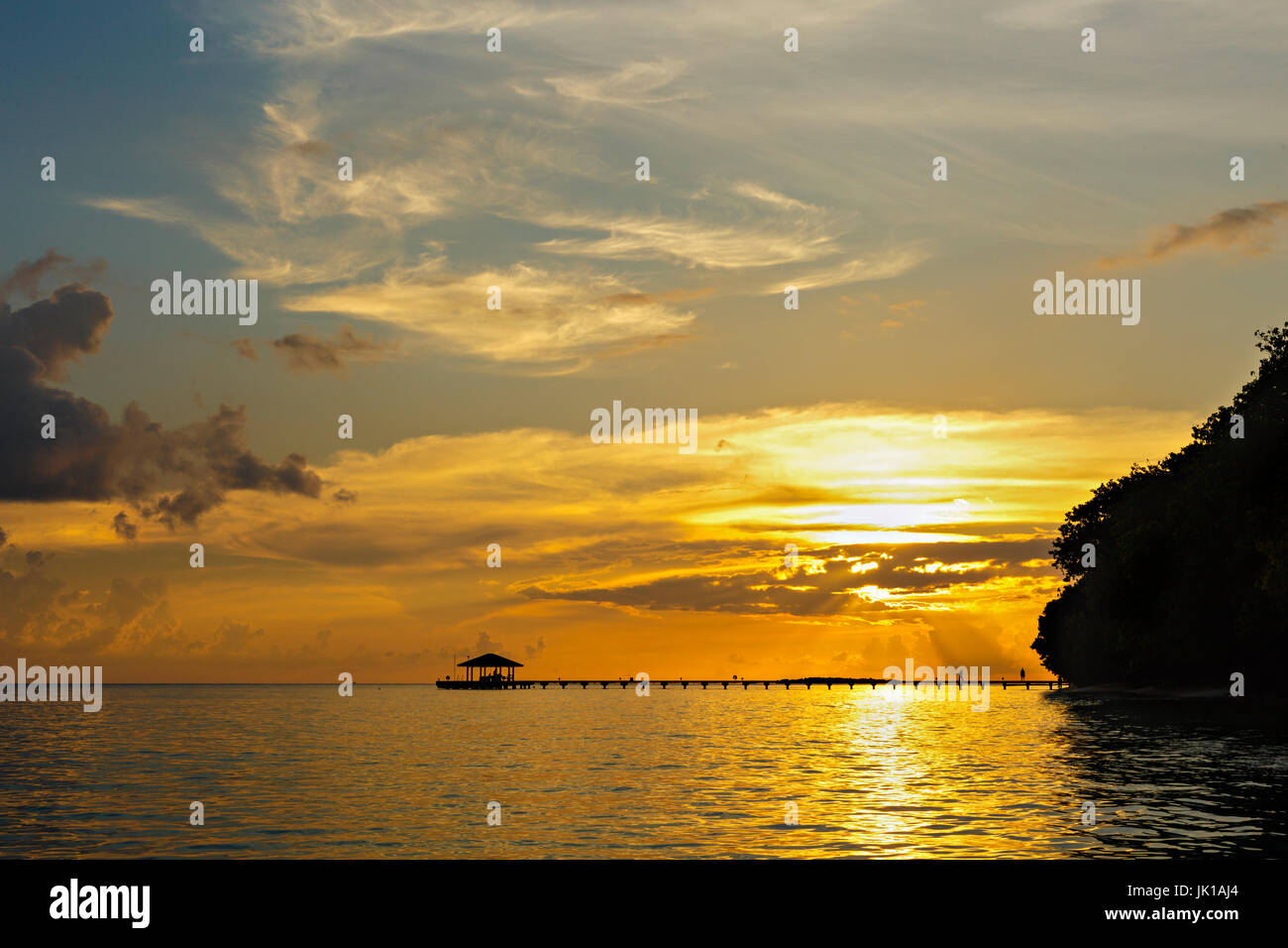 Beautiful tropical sunset on the beach Stock Photo - Alamy