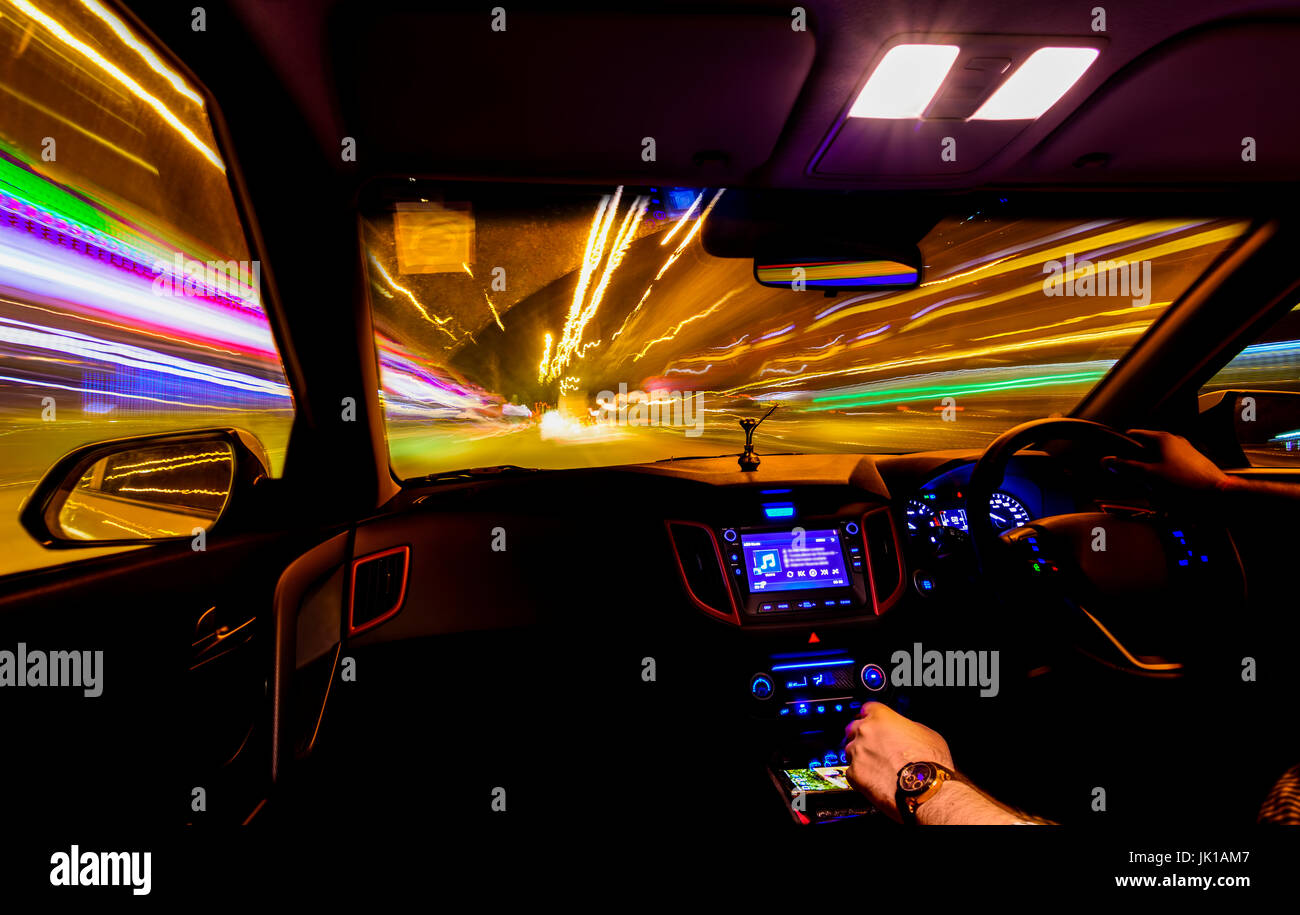 Light trails of highway street lights and moving cars from inside the ...