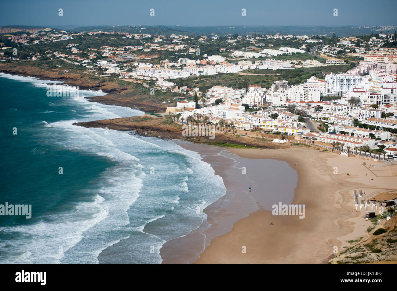 the beach with the village of Luz at the Algarve of Portugal in Europe ...