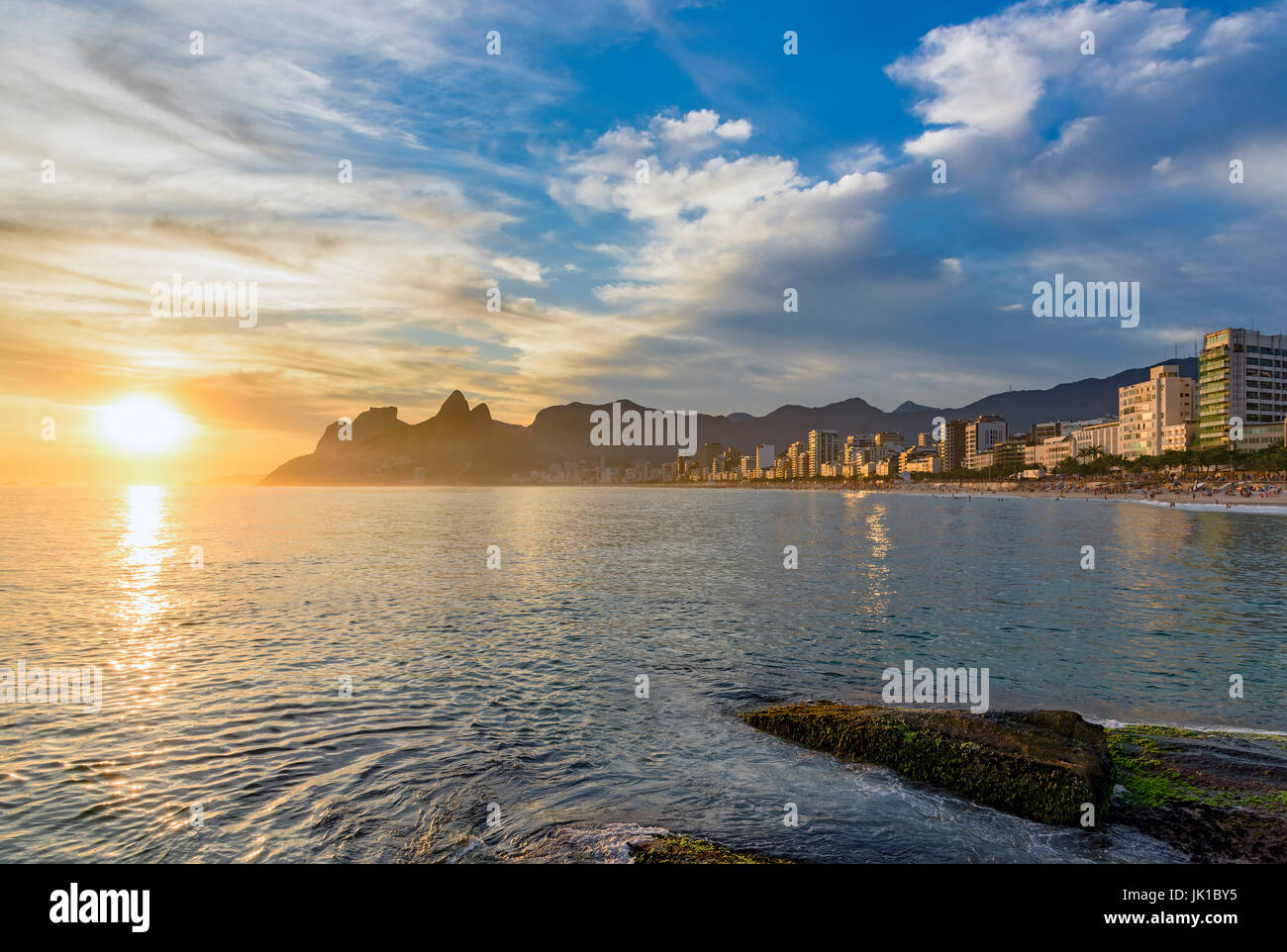 Summer sunset at Ipanema beach in Rio de Janeiro with Two Brothers hill ...