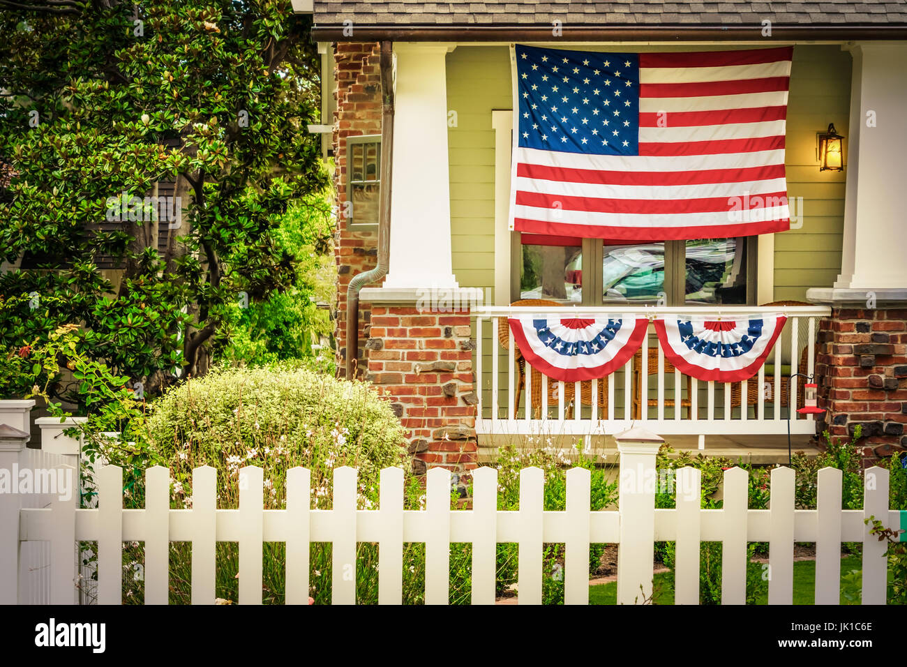 Flags in front of home in southern California Stock Photo - Alamy