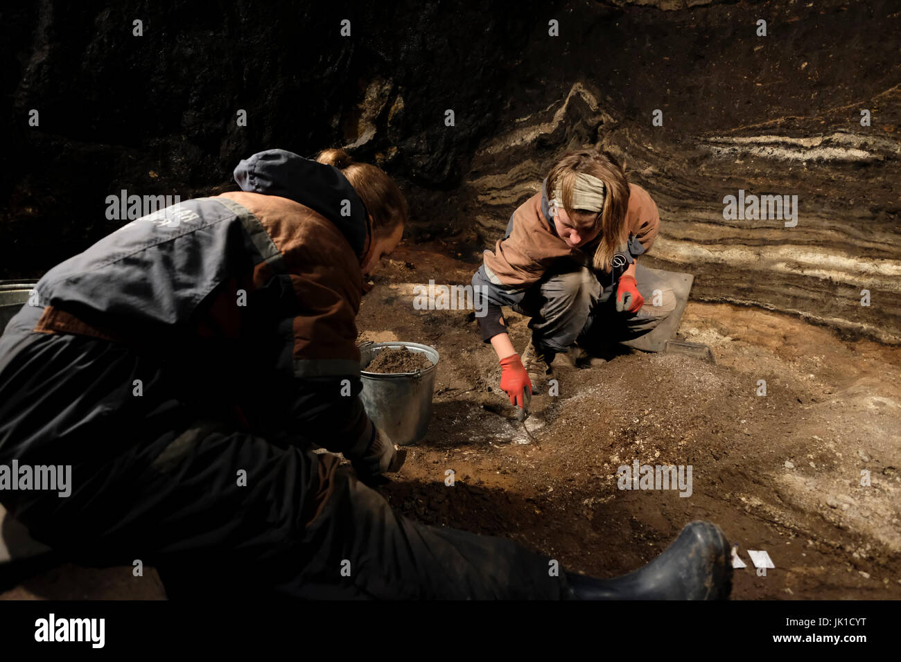 Russian archeologists dig inside Denisova cave located in a region ...