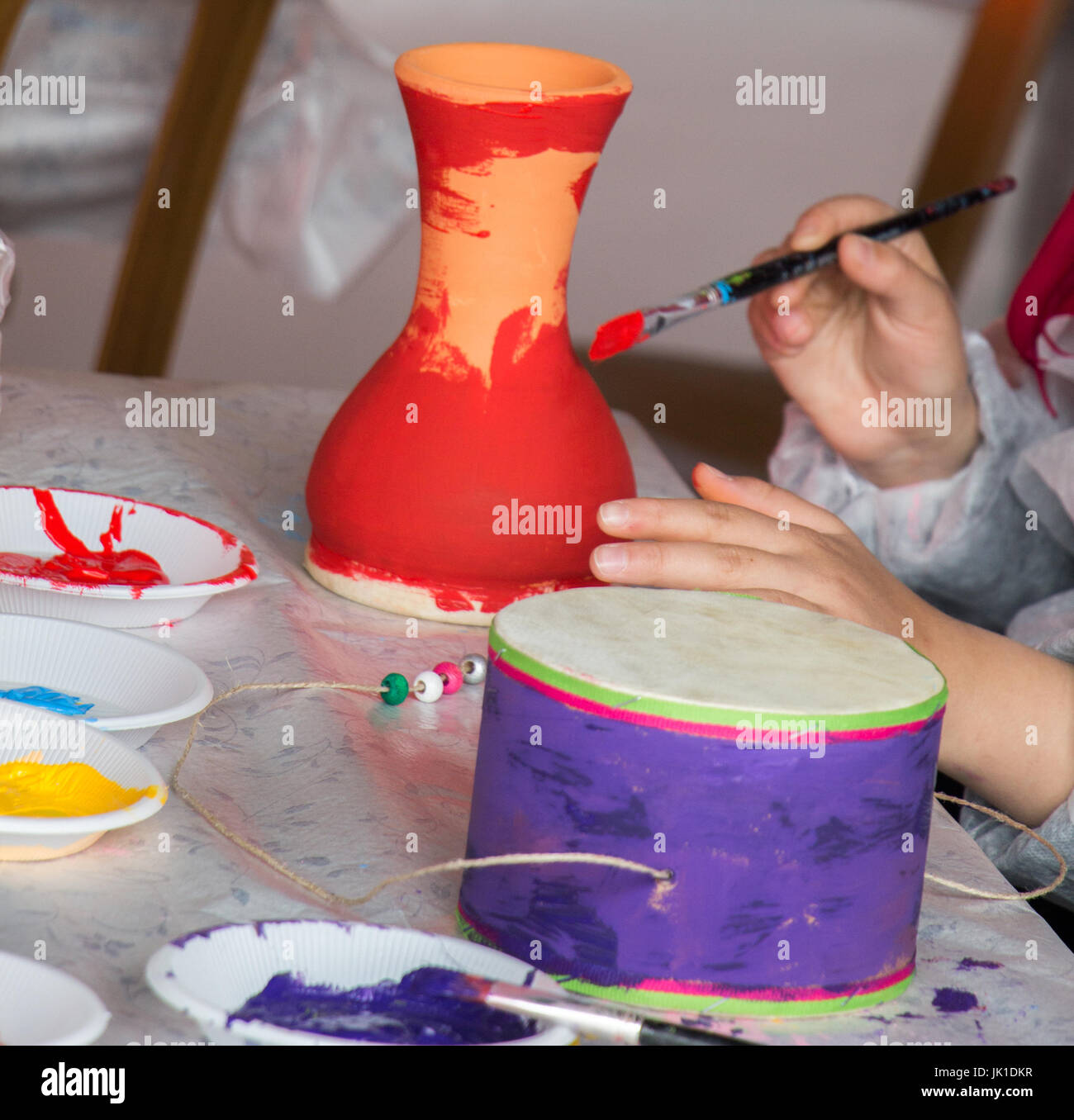 Young children decorating their handmade clay pottery Stock Photo - Alamy