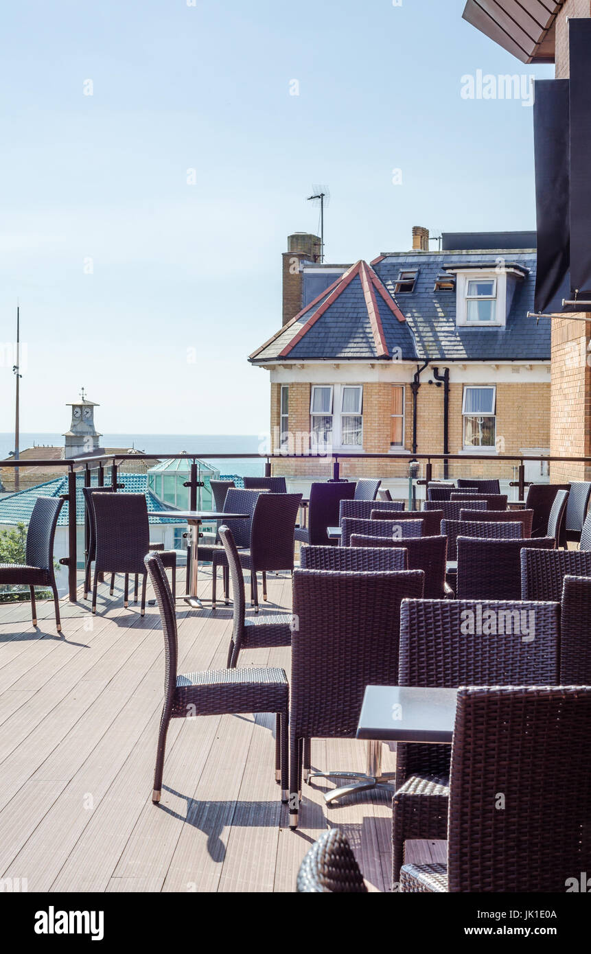 Empty tables and chairs in front of the restaurant, place to serve ...
