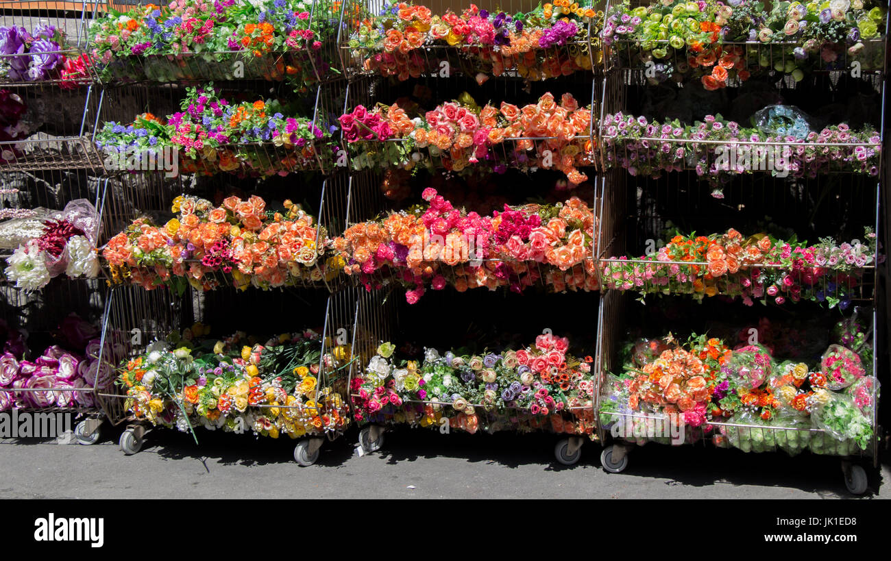 Colorful fake artificial flowers in view Stock Photo - Alamy