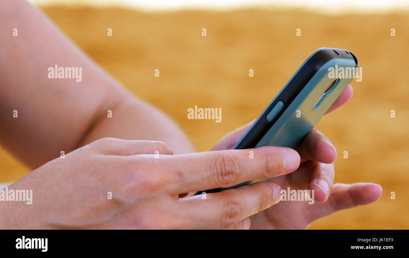 Female hand with smartphone closeup Stock Photo - Alamy
