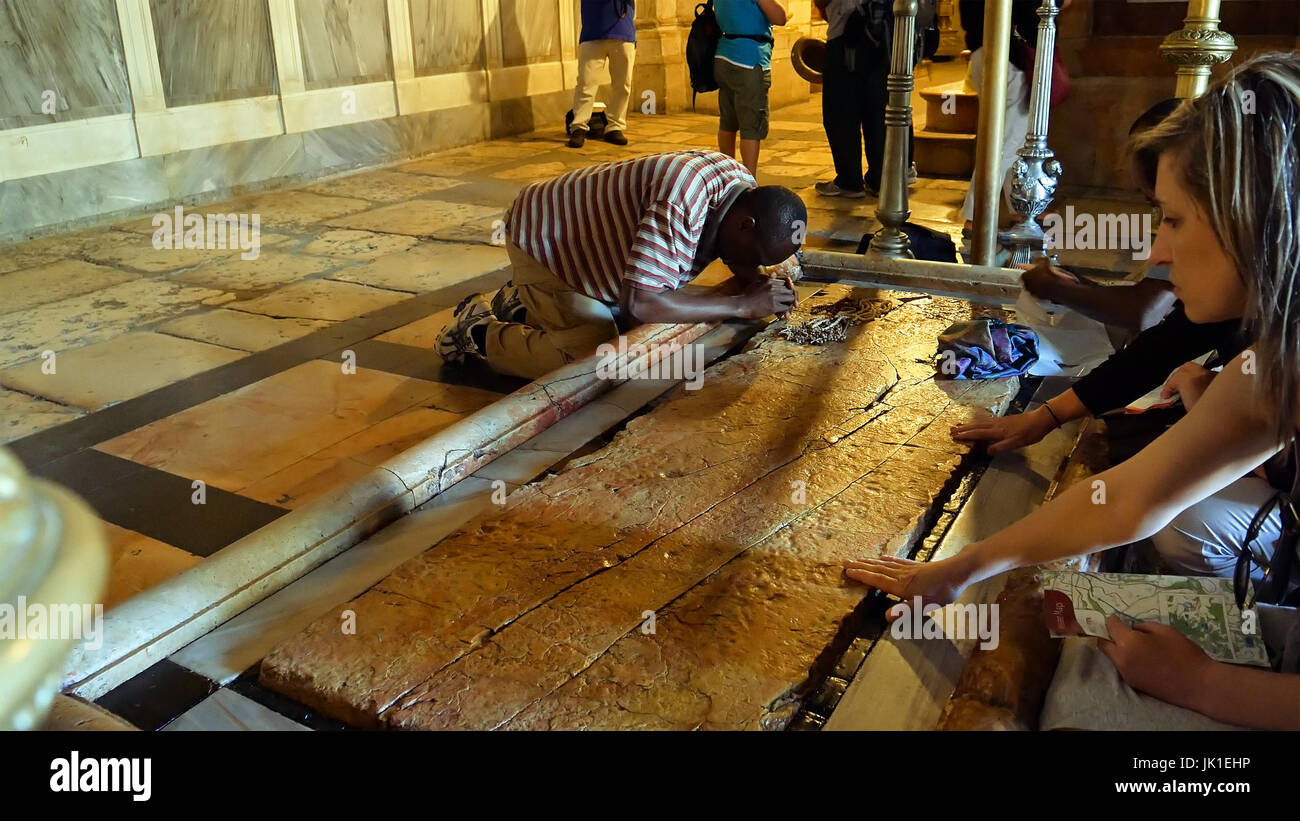 Prayers at the Stone of Anointing in Jerusalem Stock Photo - Alamy