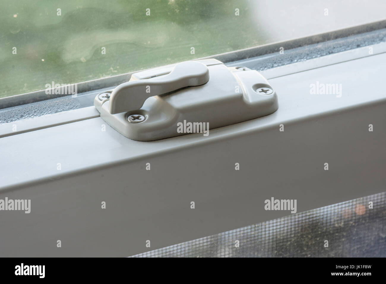 A lock or latch on a window in a home Stock Photo - Alamy