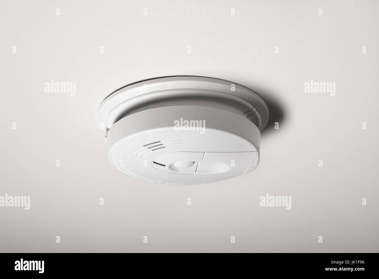 A smoke detector on the ceiling of a home Stock Photo - Alamy
