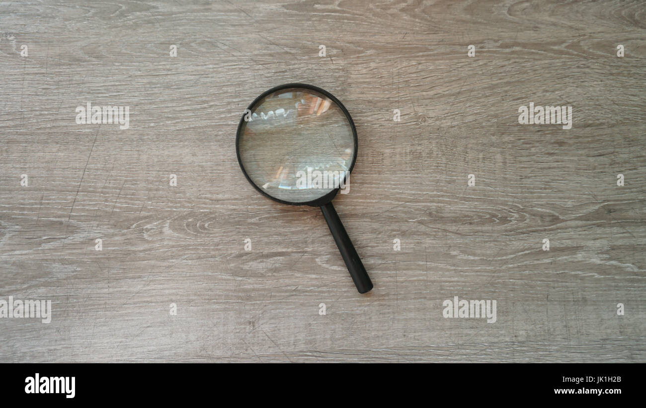 magnifying glass on the grey laminate background Stock Photo - Alamy