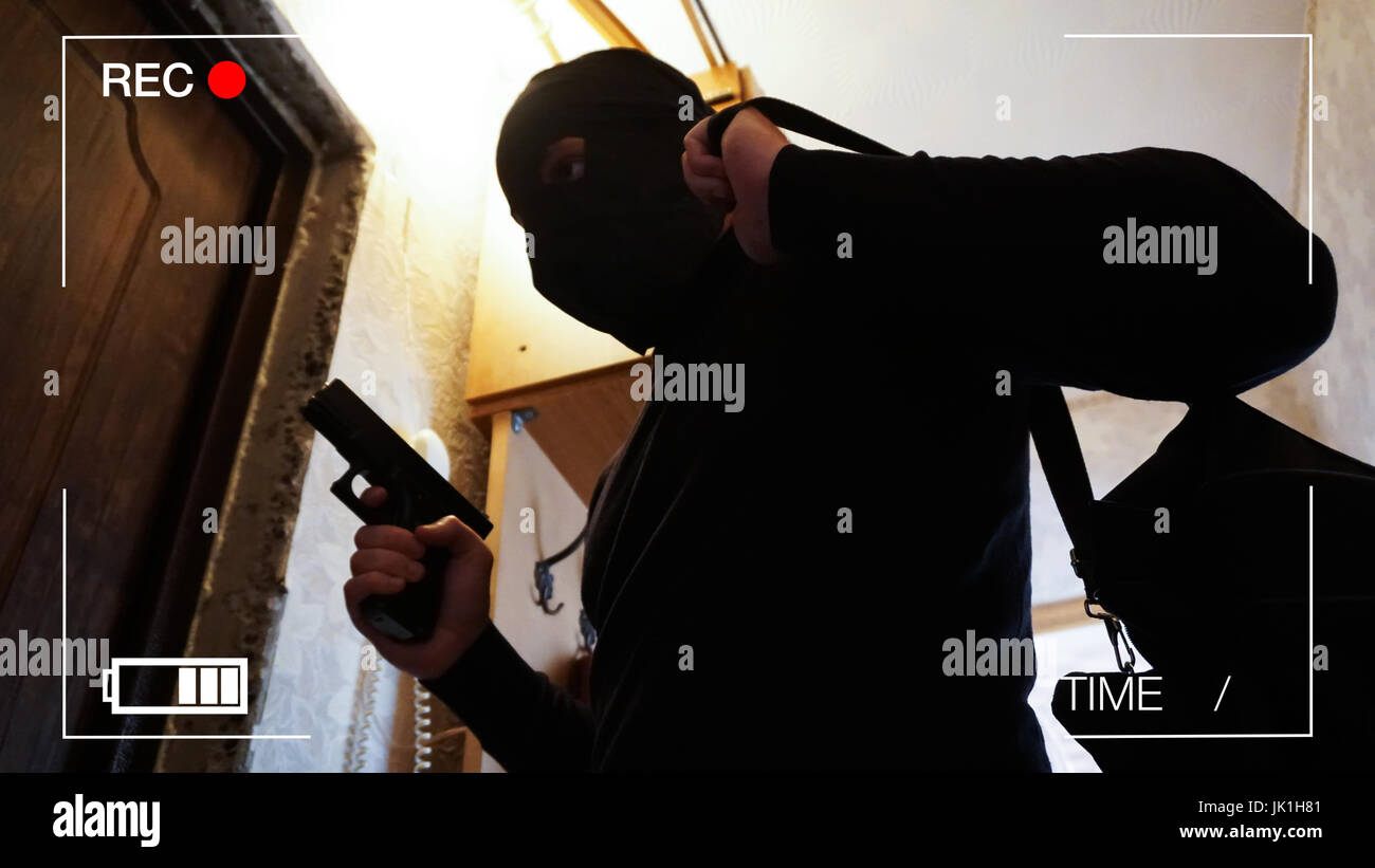 surveillance camera recorded the thief,who broke into the house with a ...