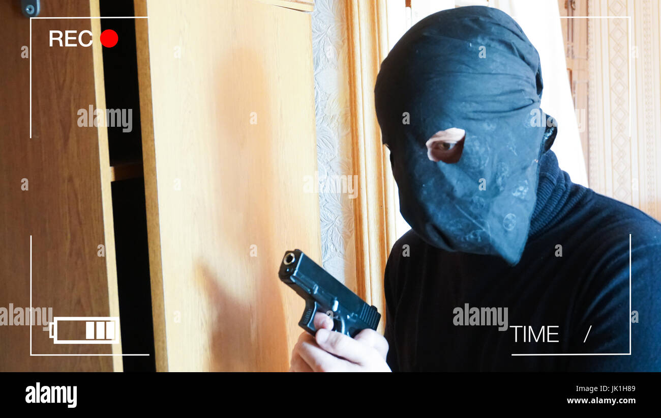 surveillance camera recorded the thief,who broke into the house with a ...