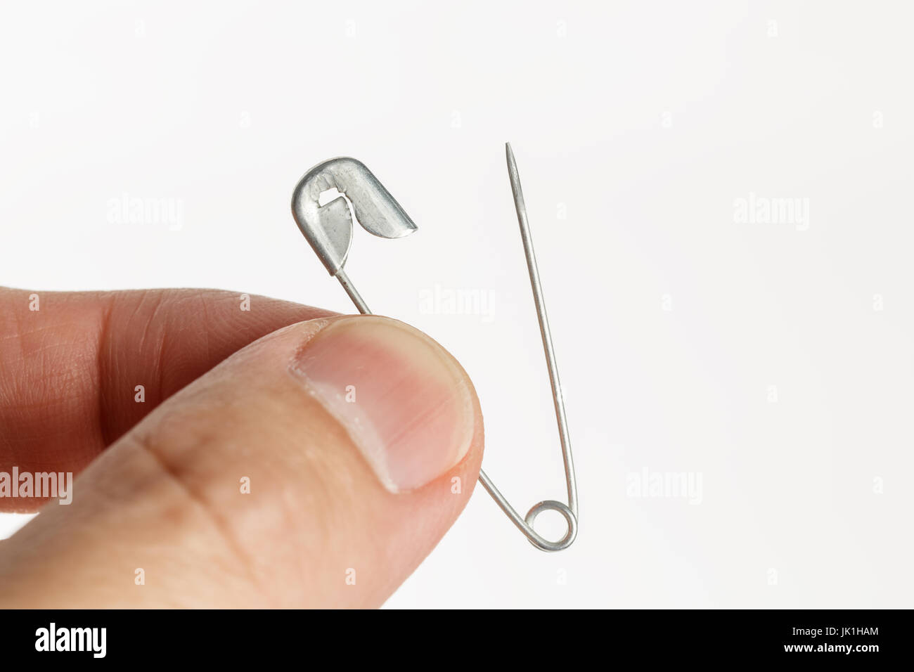 sewing safety pin isolated on a white background Stock Photo - Alamy