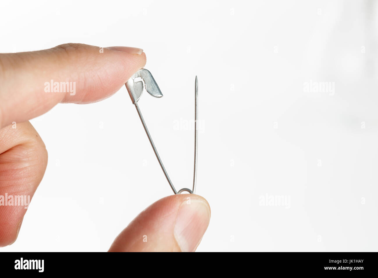 sewing safety pin isolated on a white background Stock Photo - Alamy