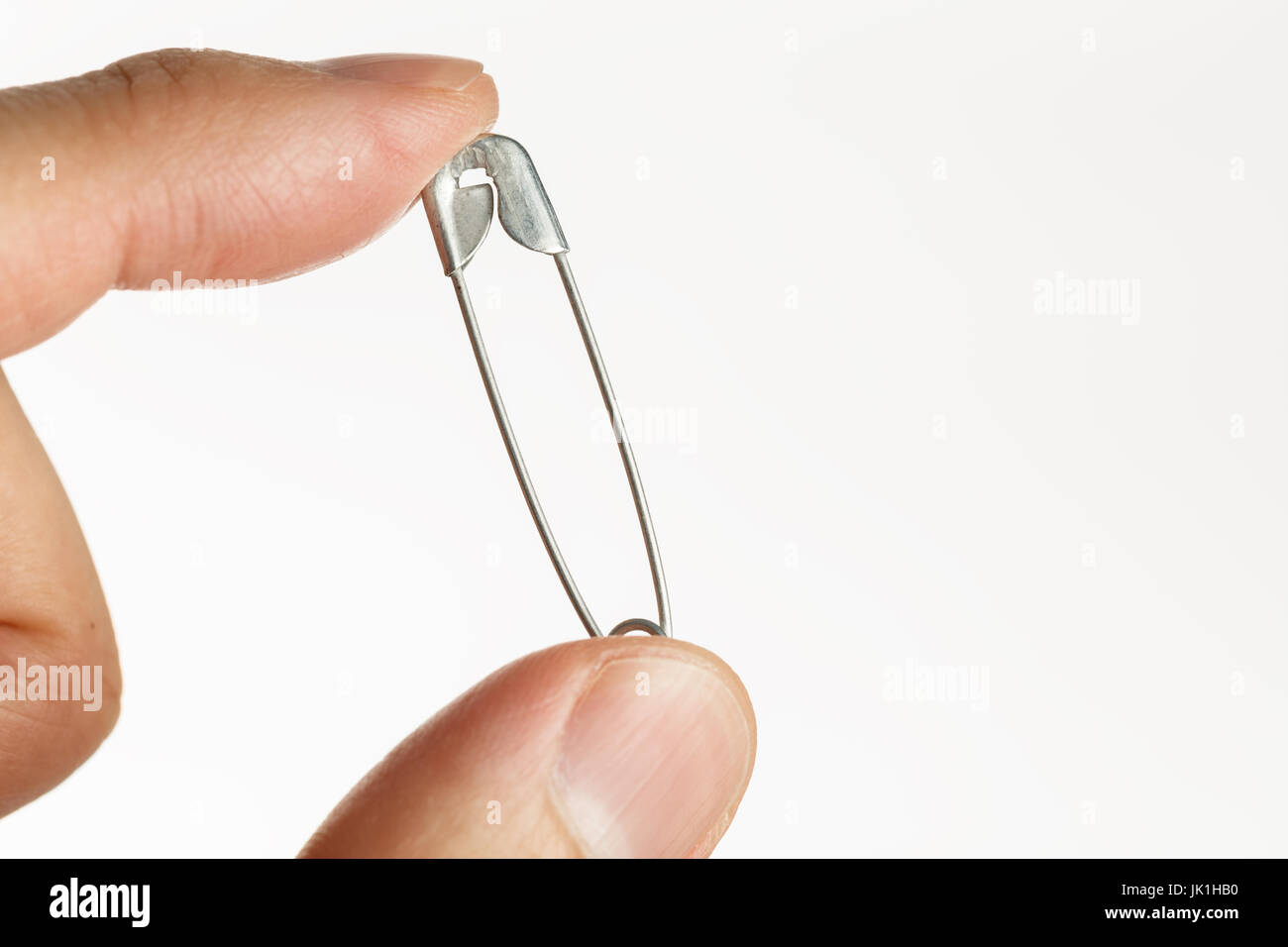 sewing safety pin isolated on a white background Stock Photo - Alamy