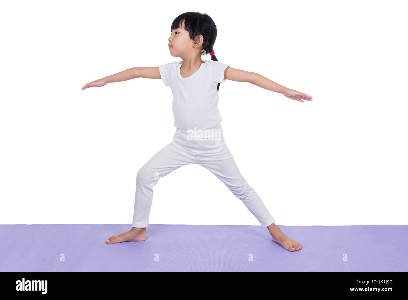 Asian Chinese little girl practicing yoga pose on a mat indoor Stock ...