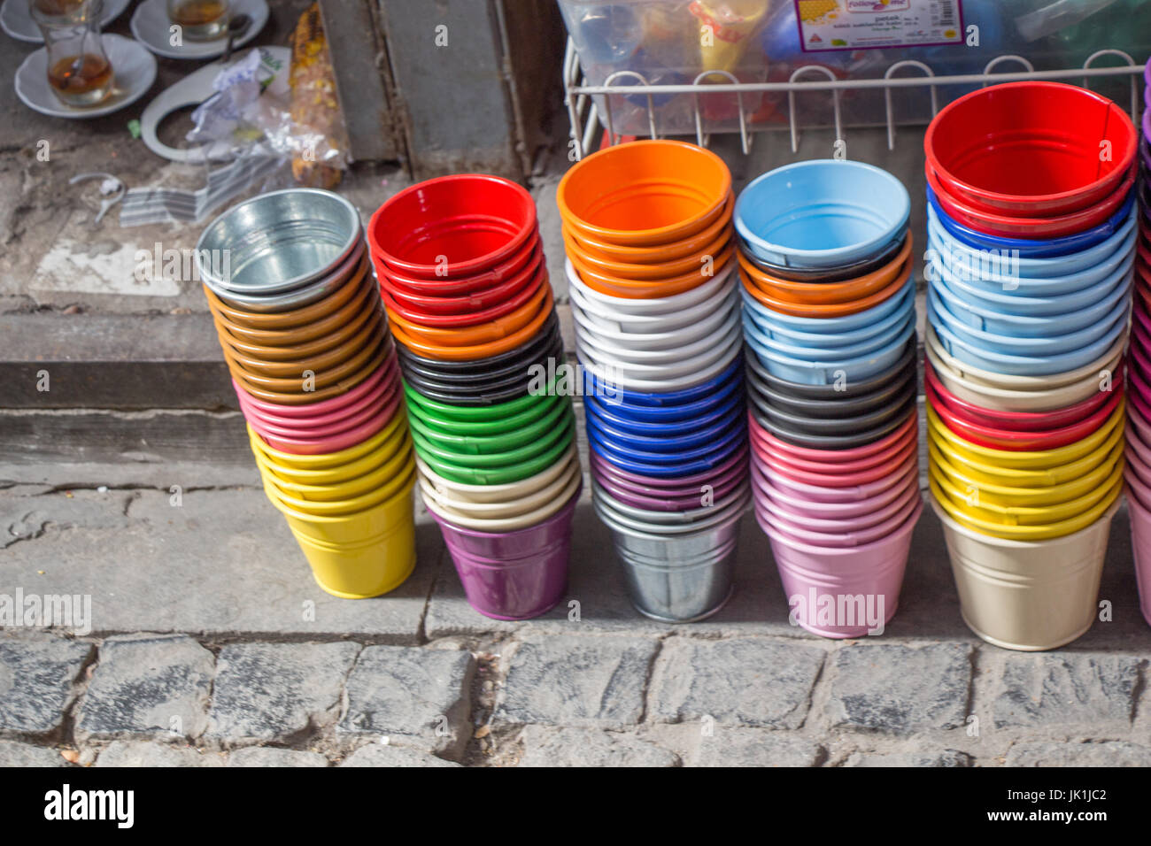 Little set of buckets of various colors in a market place Stock Photo ...