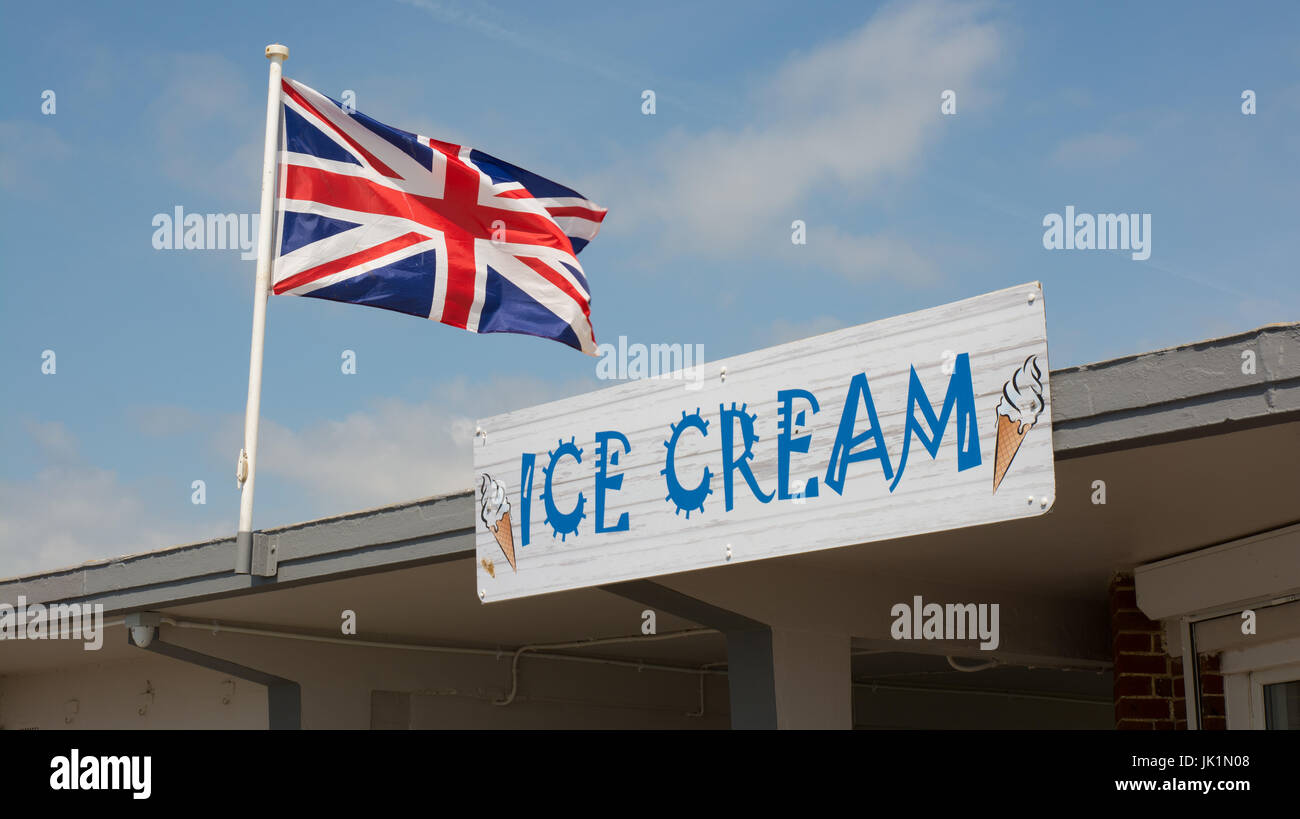 British Union flag (Union Jack) next to Ice Cream sign on the seafront ...