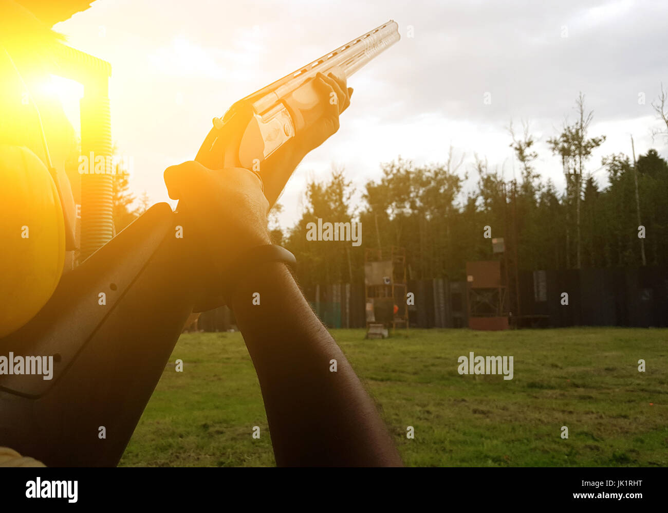 Man holding gun in street Stock Photo - Alamy