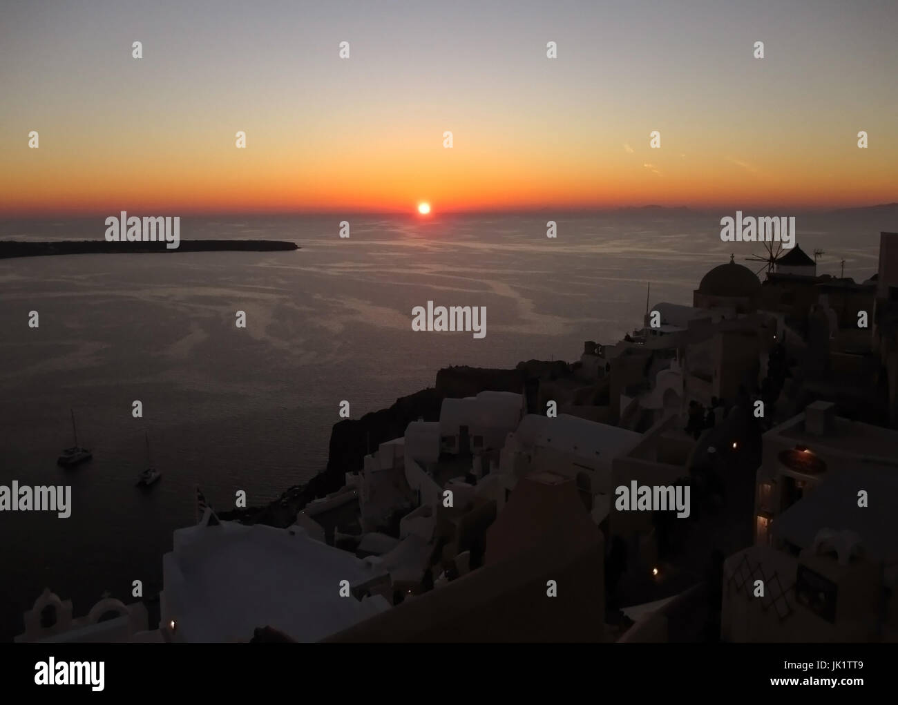 Stunning Sunset at Oia Village, Santorini Island of Greece Stock Photo ...