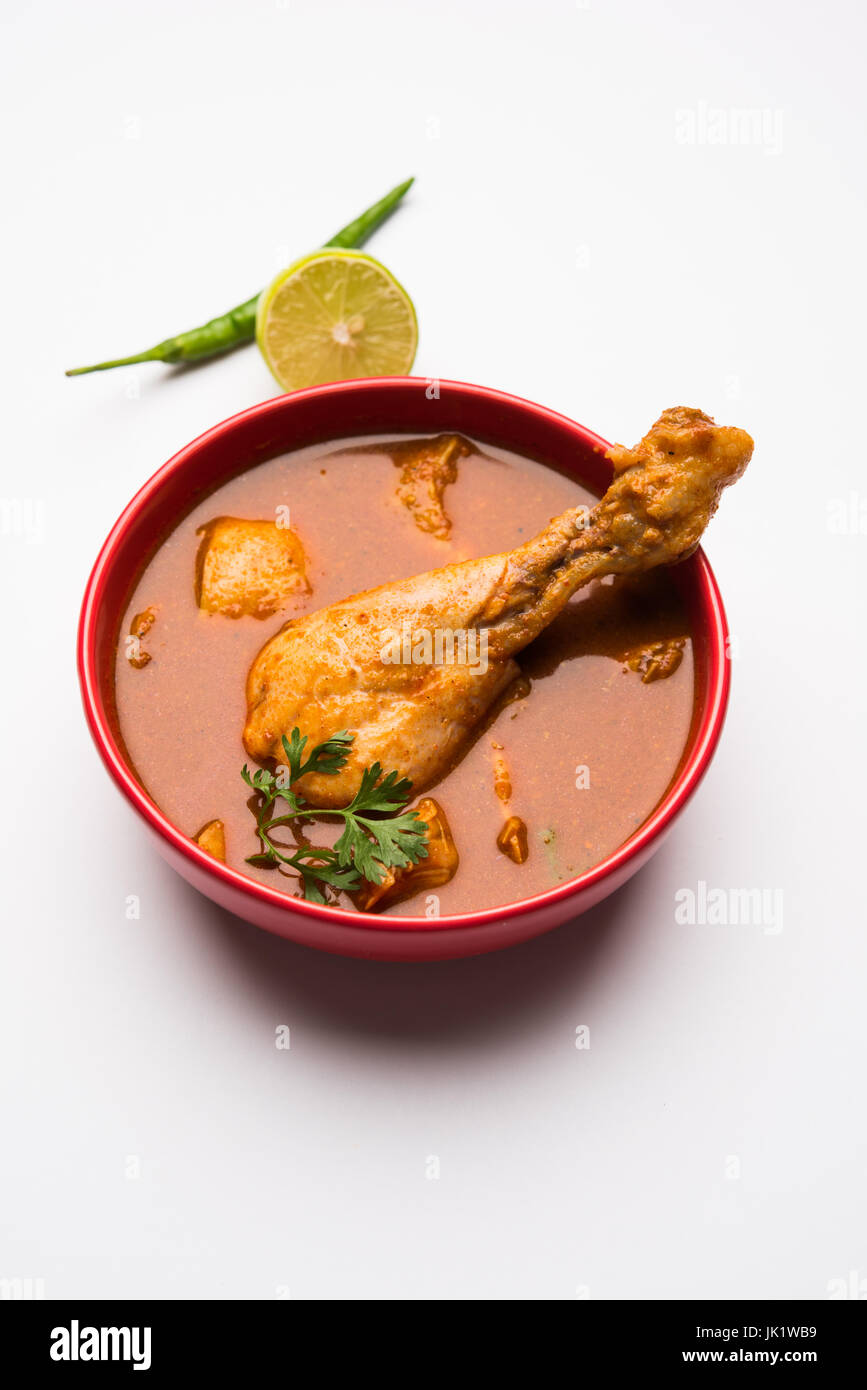 Indian spicy Chicken curry or masala chicken with prominent leg piece ...
