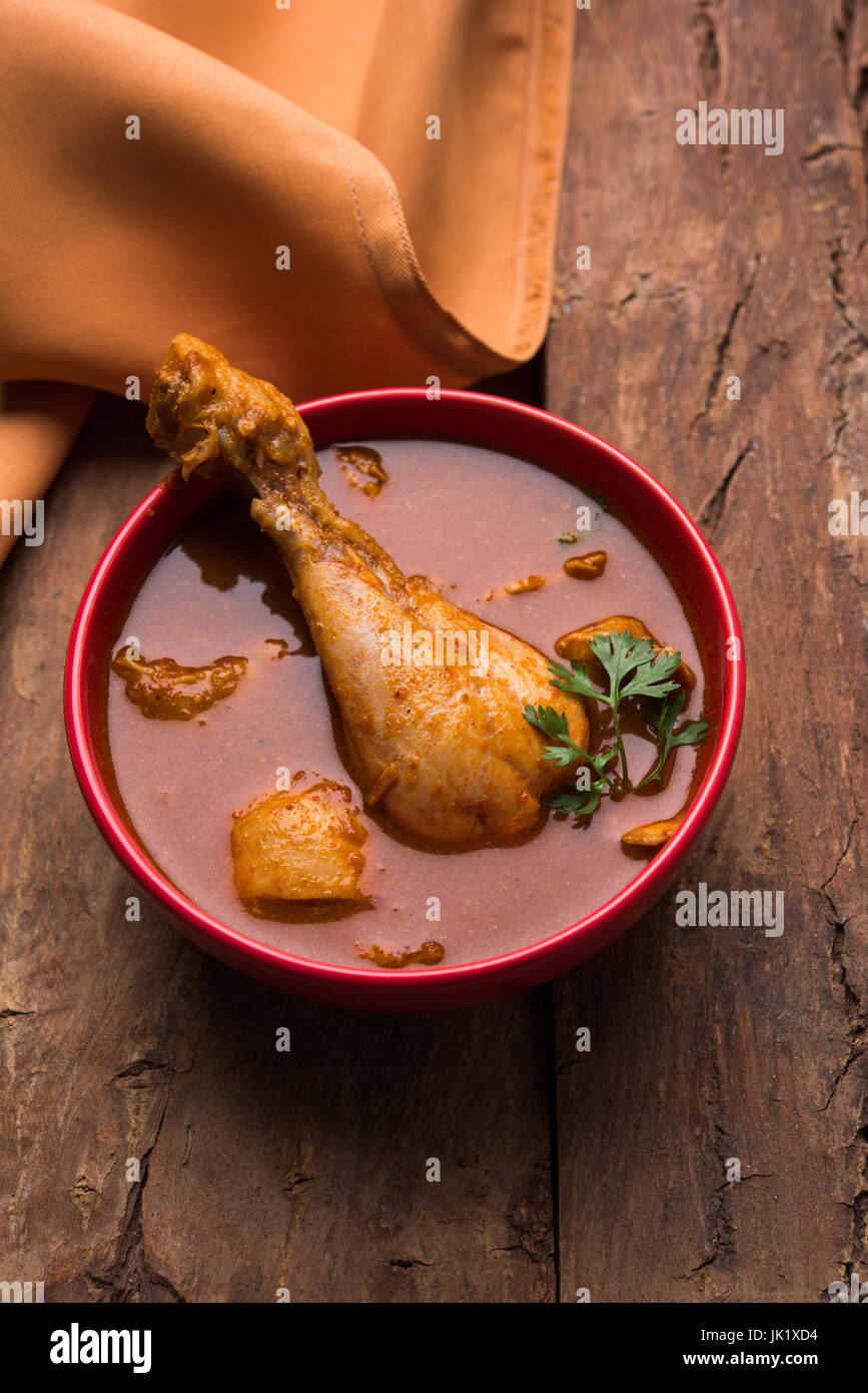 Indian spicy Chicken curry or masala chicken with prominent leg piece ...