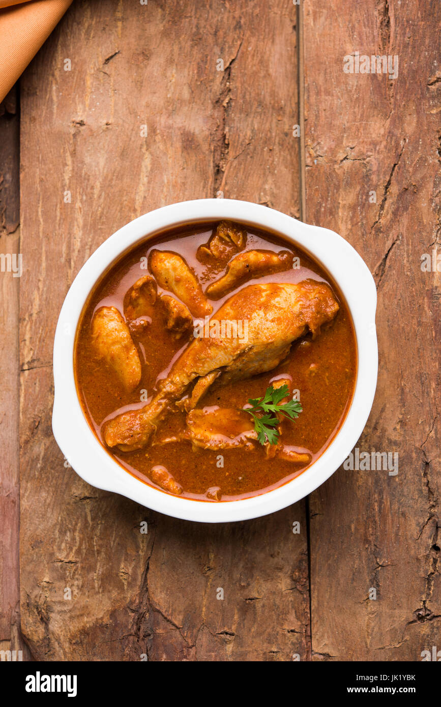Indian spicy Chicken curry or masala chicken with prominent leg piece ...