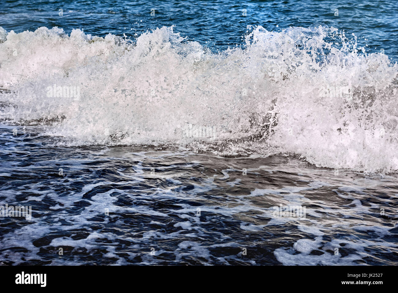 Surf of dark blue sea waves at sunny day Stock Photo - Alamy