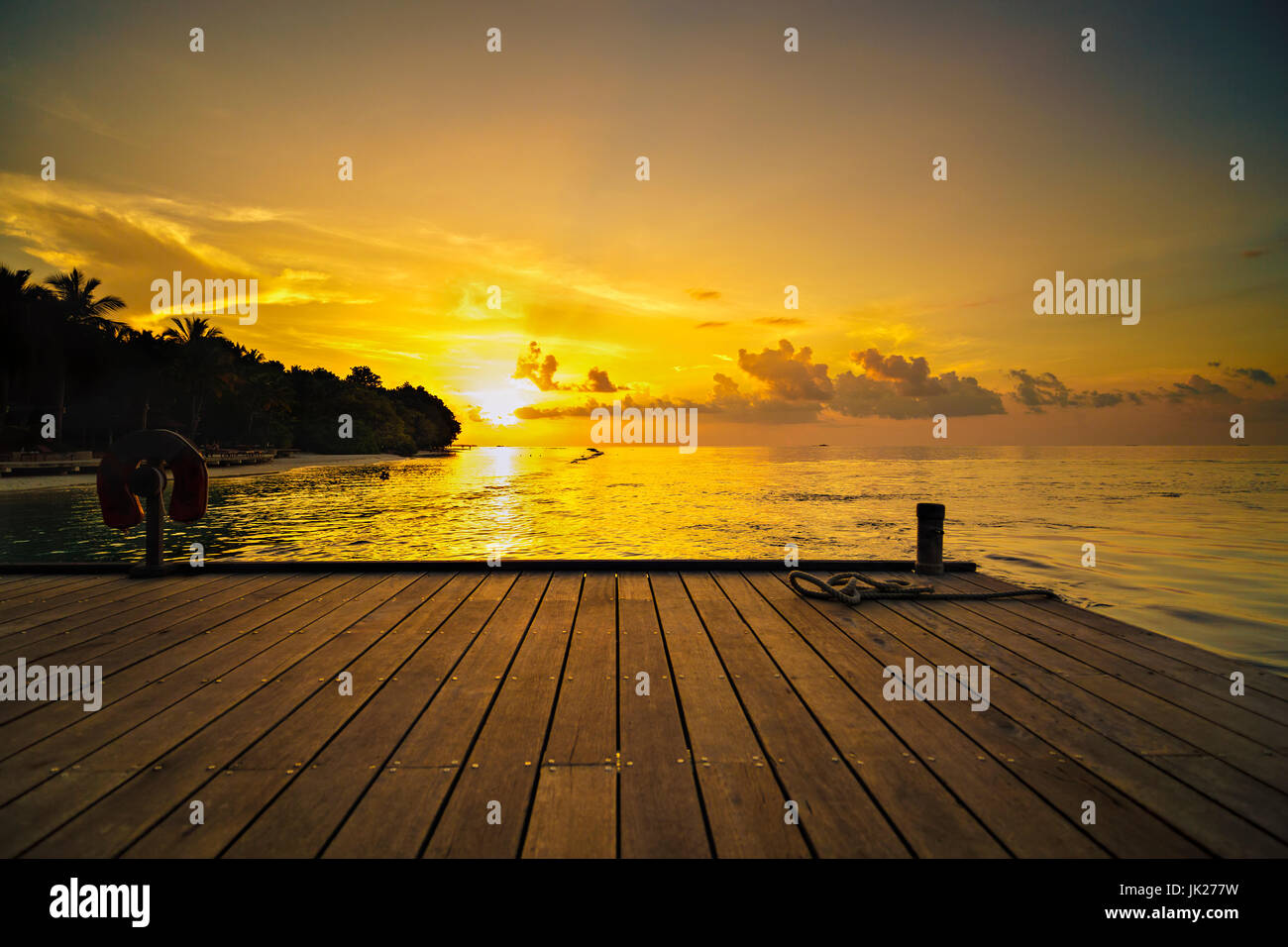 beautiful sunset in luxury resort in the tropics Stock Photo - Alamy