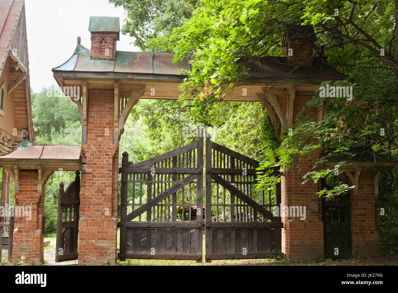 Wooden vintage antique gate and brick columns Stock Photo - Alamy