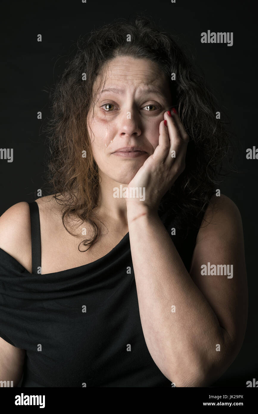 Scared woman crying, victim of domestic violence Stock Photo - Alamy