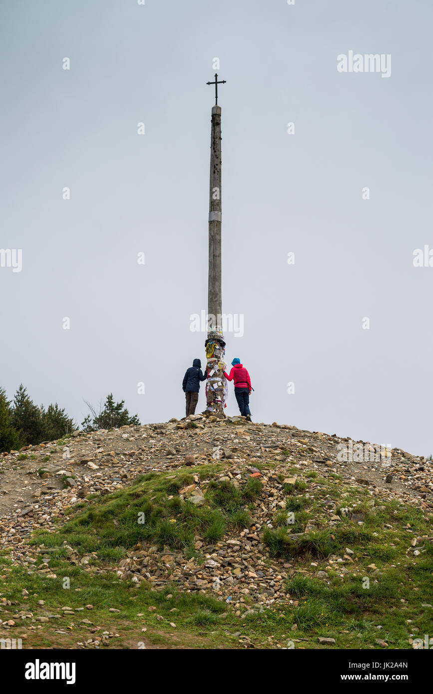 Pilgrims on the Cruz de Ferro, Spain. Camino de Santiago Stock Photo ...