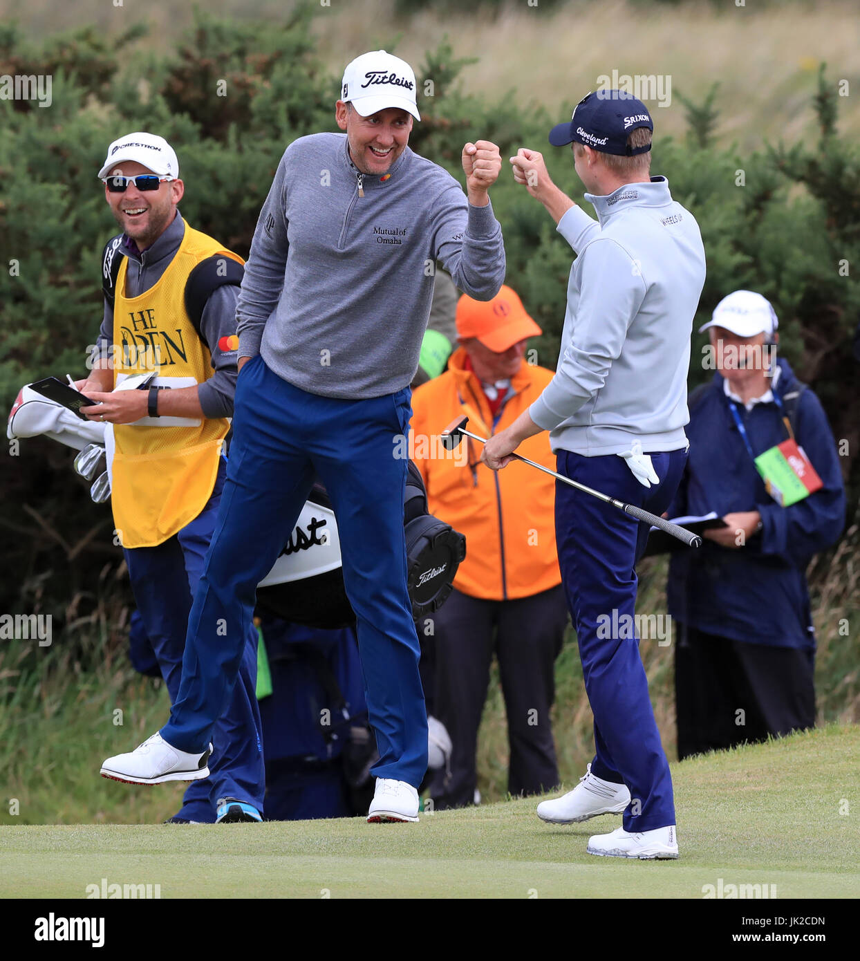England's Ian Poulter (left) celebrates with Scotland's Russell Knox ...