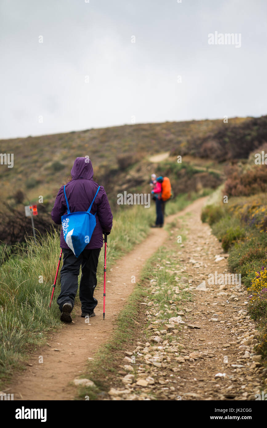 Pilgrims walking camino de Santiago near of the Cruz de Ferro, Spain, Europe Stock Photo - Alamy