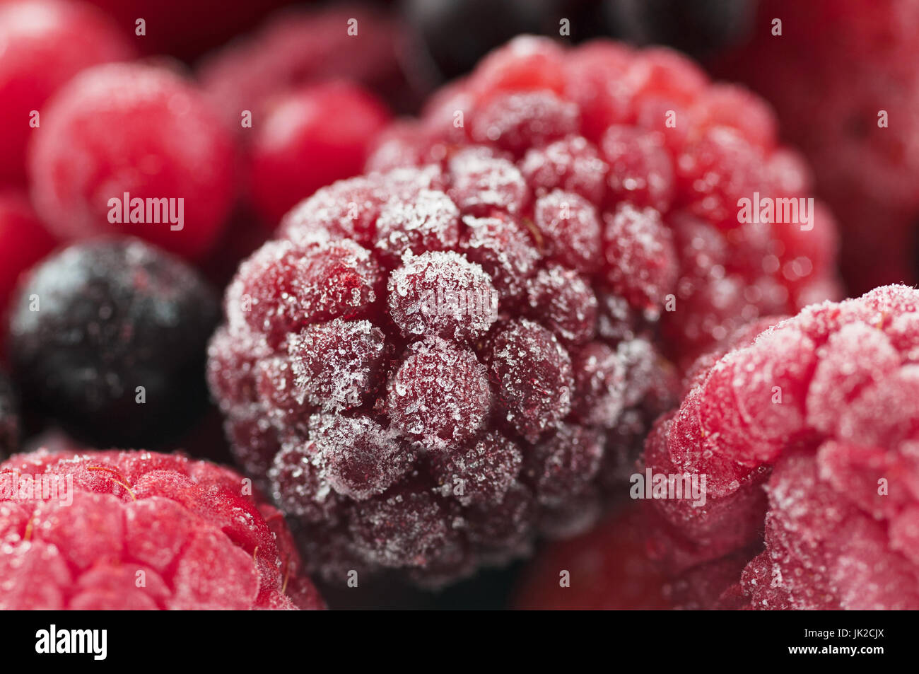 Mixed colorful frozen fruit Stock Photo - Alamy