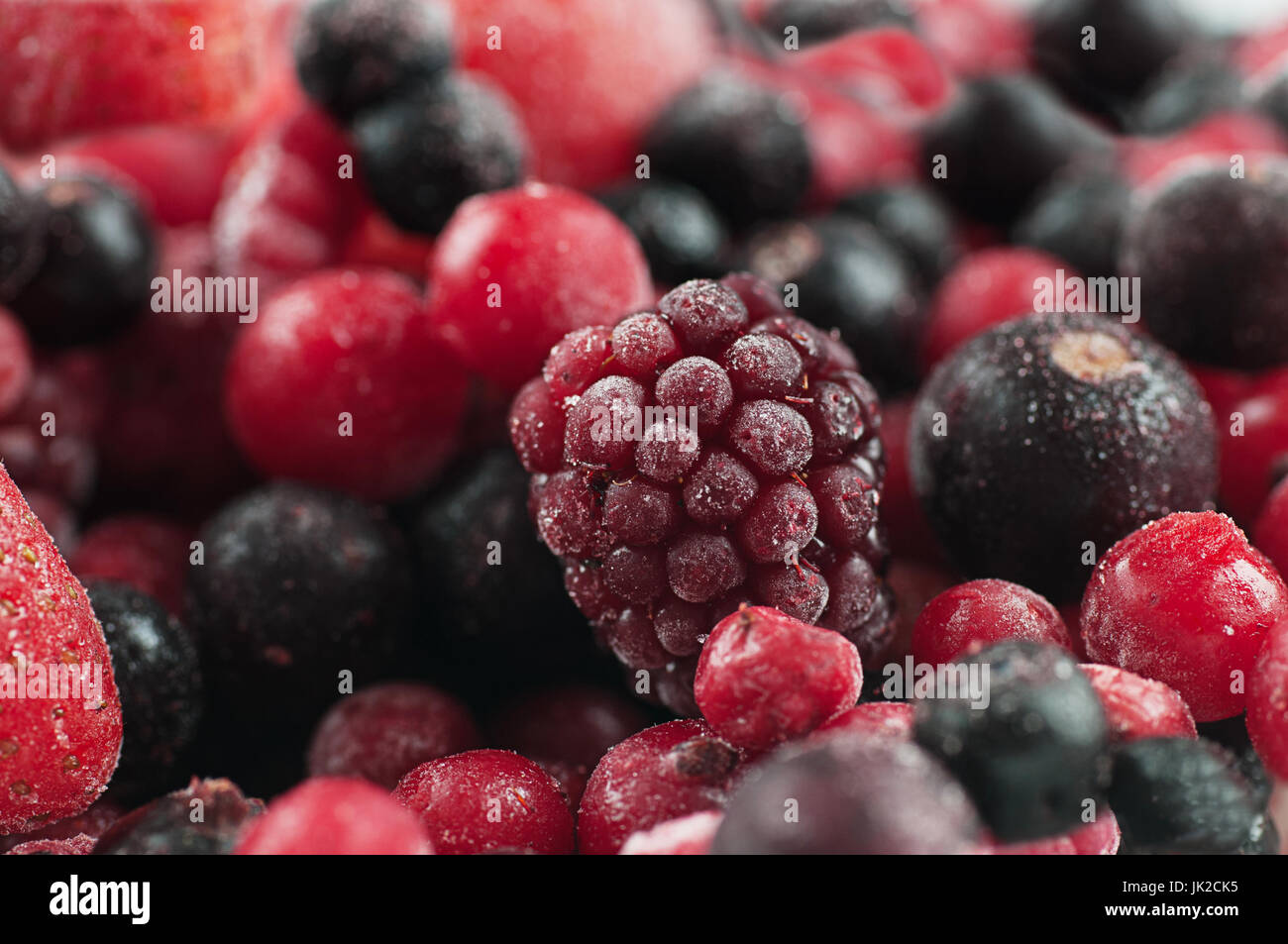 Mixed colorful frozen fruit Stock Photo - Alamy