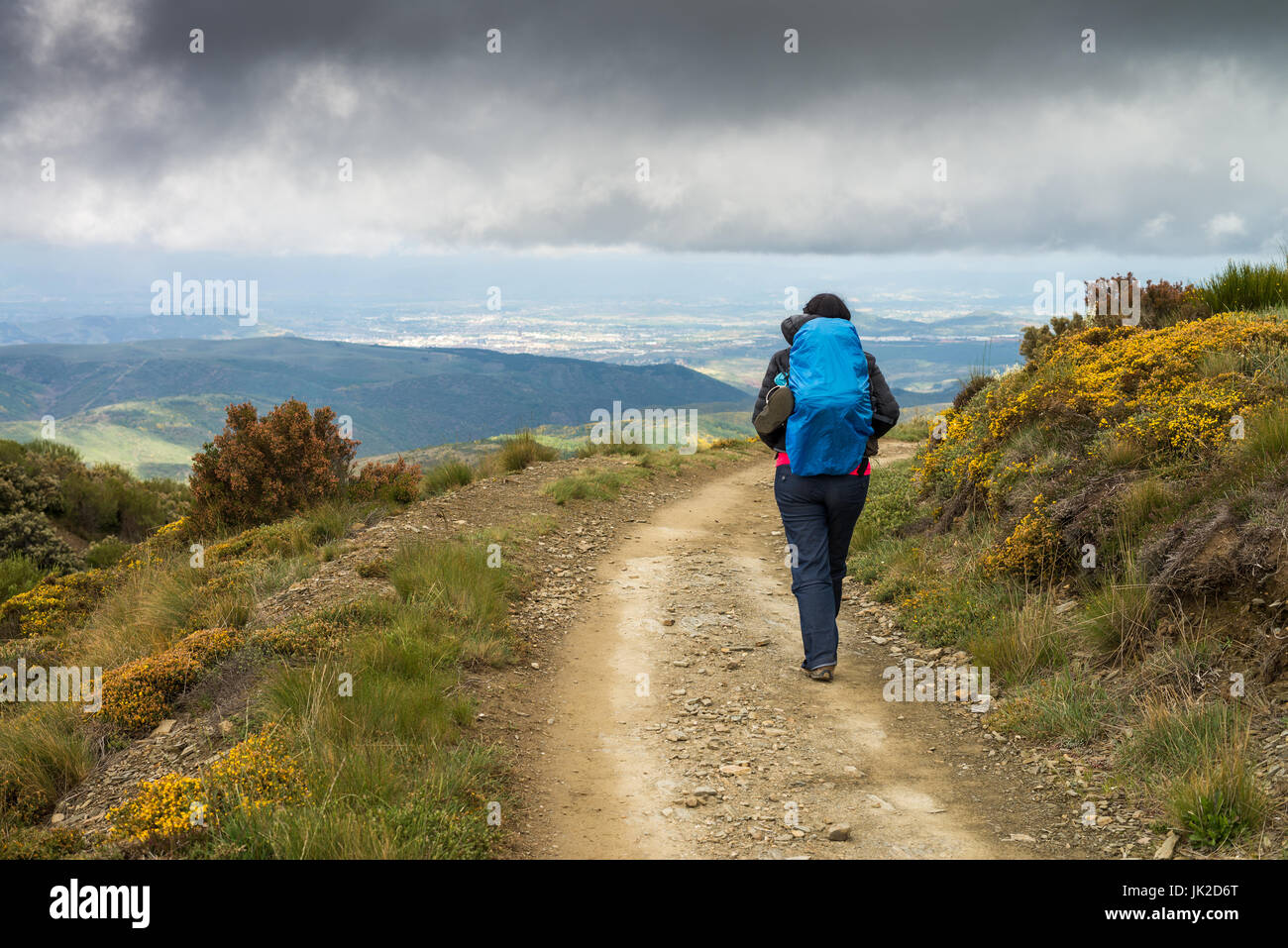 Pilgrims walking camino de Santiago near of the Cruz de Ferro, Spain, Europe Stock Photo - Alamy