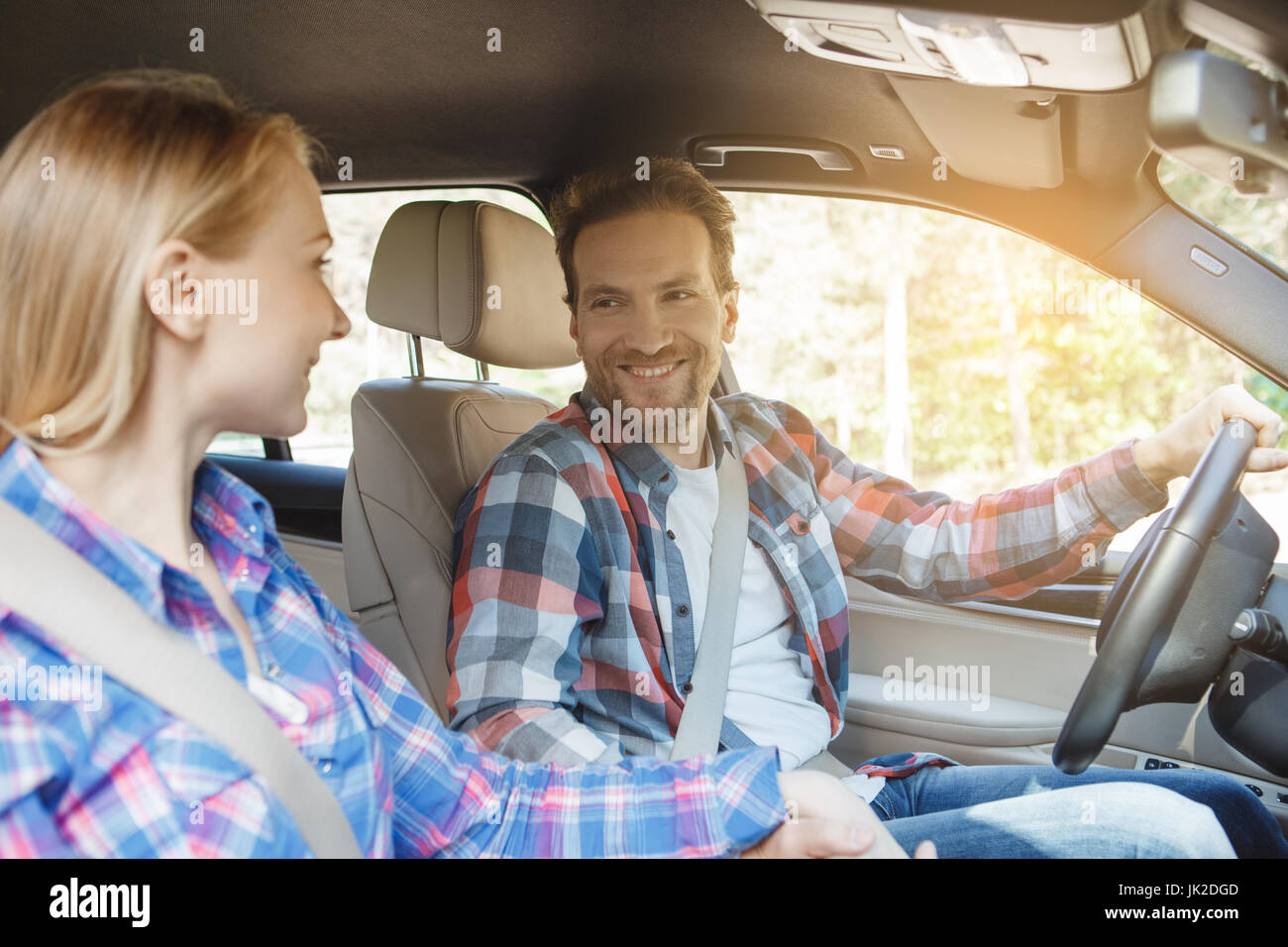 Travel by car family ride together couple holding hands Stock Photo - Alamy