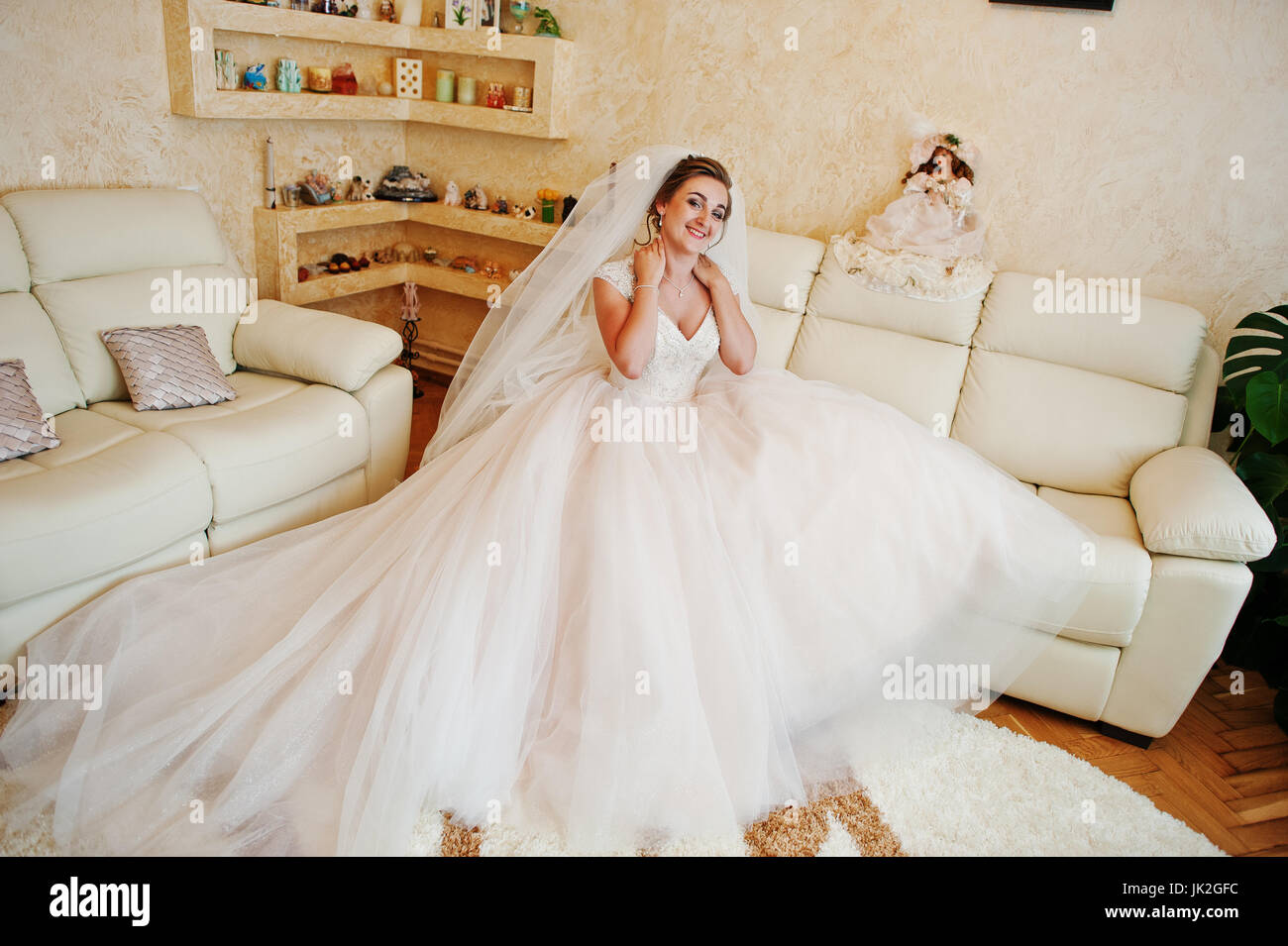 Portrait of a fabulous bride posing in her house on the wedding day ...