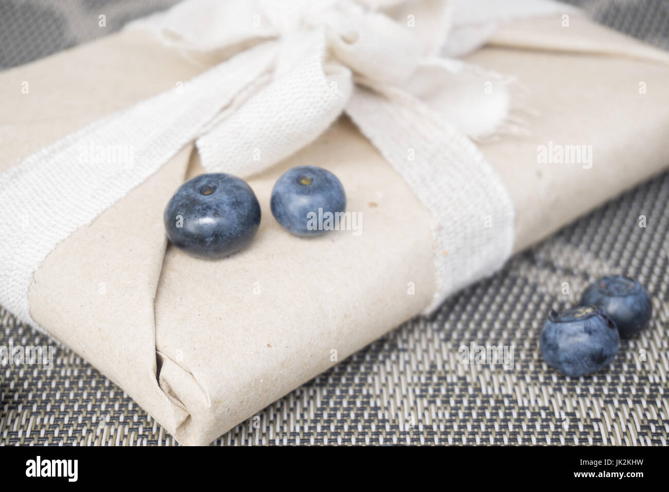 Composition of a gift in eco package and blueberries in a bowl Stock ...