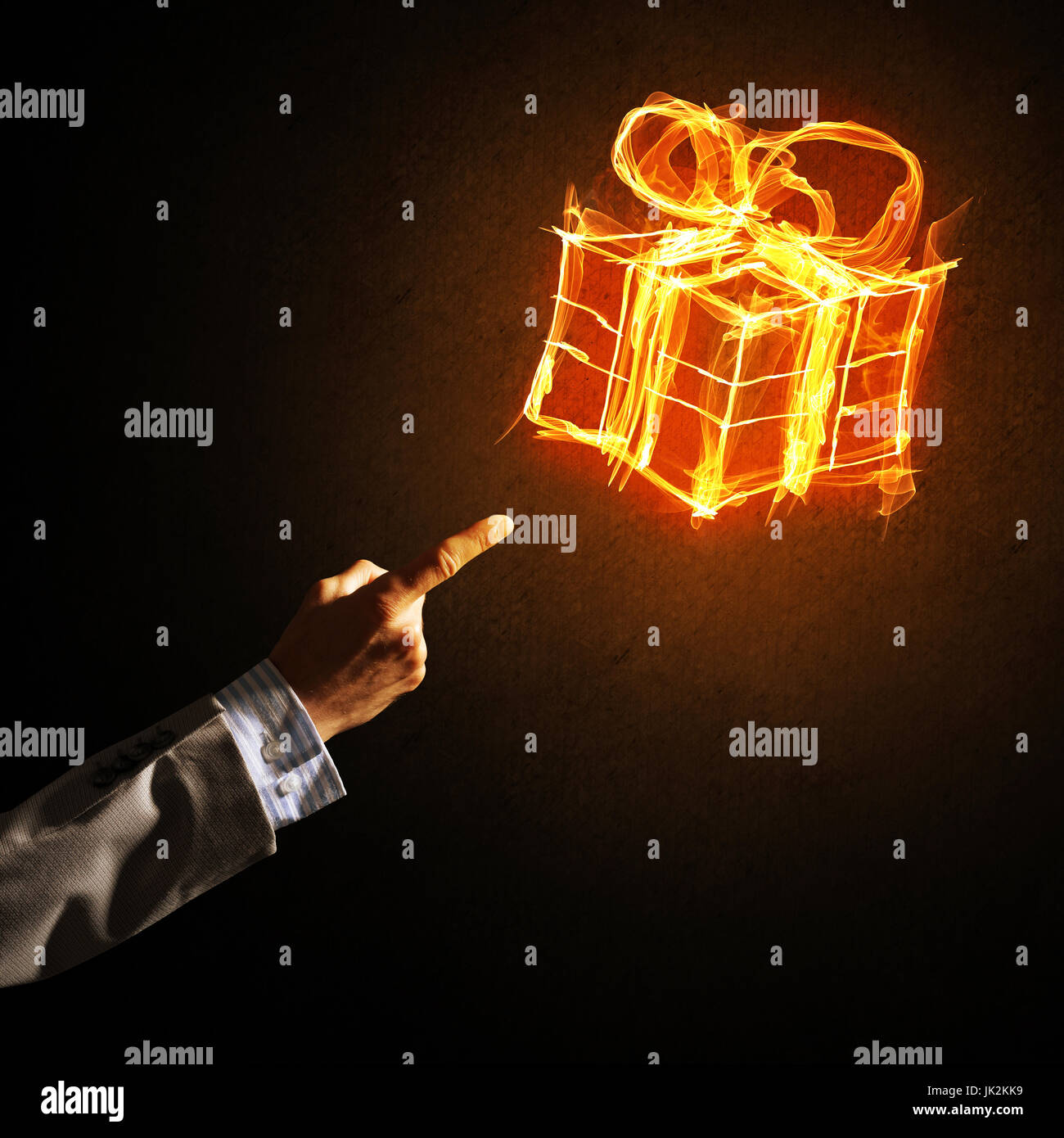 Concept of celebration with fire burning gift symbol and businessman ...