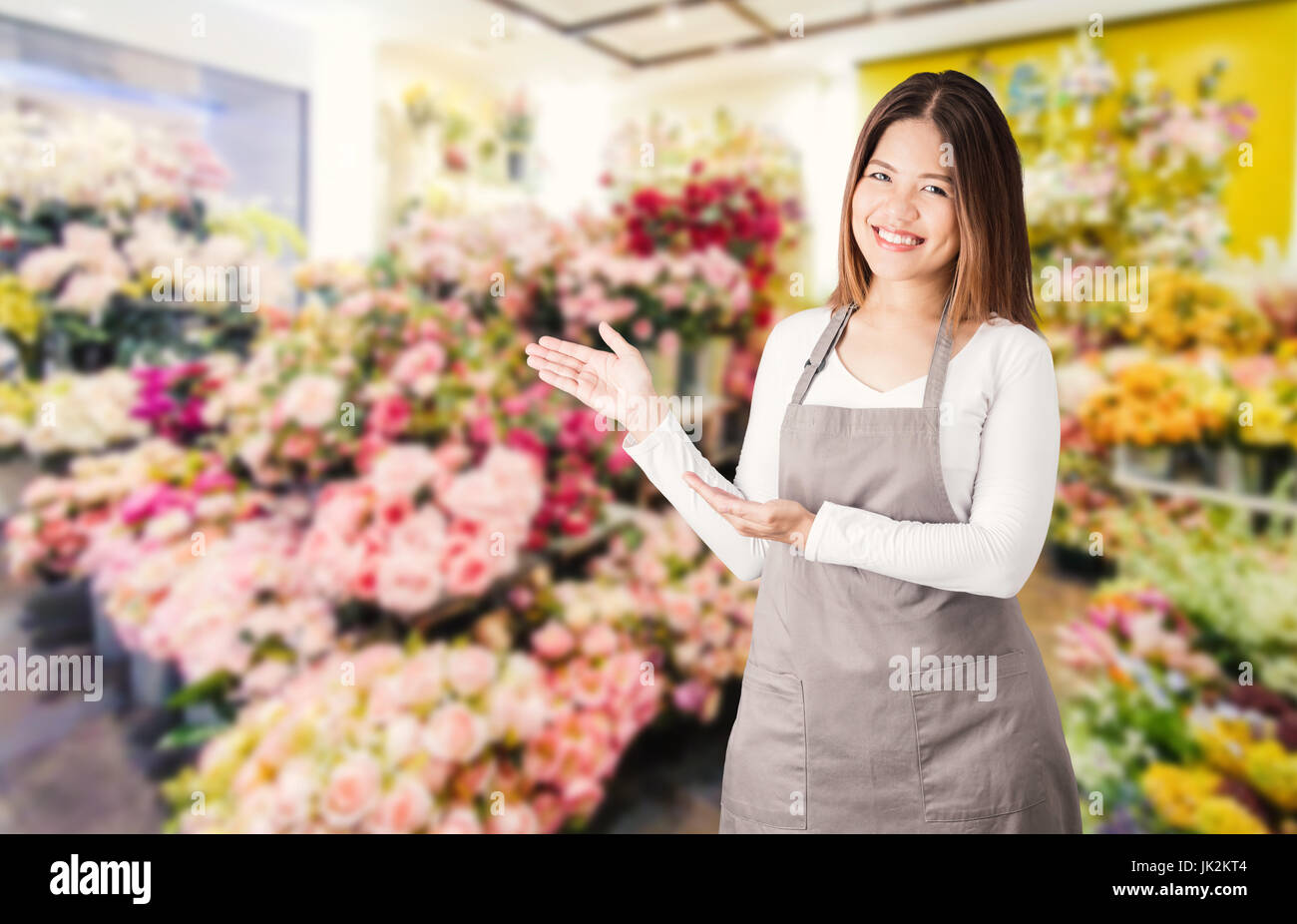 asian female florist with flower shop background Stock Photo - Alamy