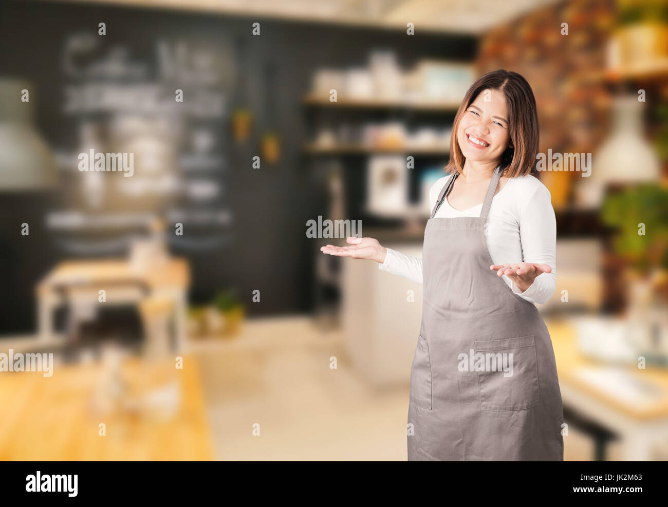 business owner with coffee shop background Stock Photo - Alamy