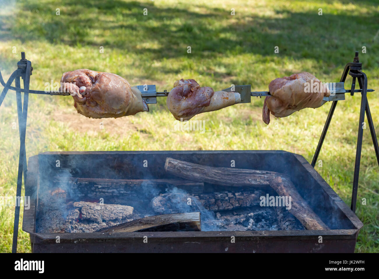 Grilled pork thigh leg on the grill.Cooking camp Stock Photo - Alamy