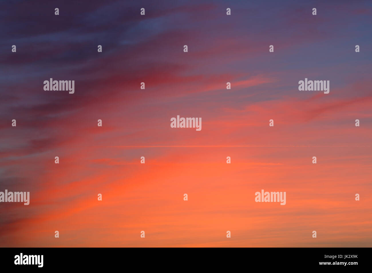 Vibrant sunset clouds in the red sky Stock Photo - Alamy