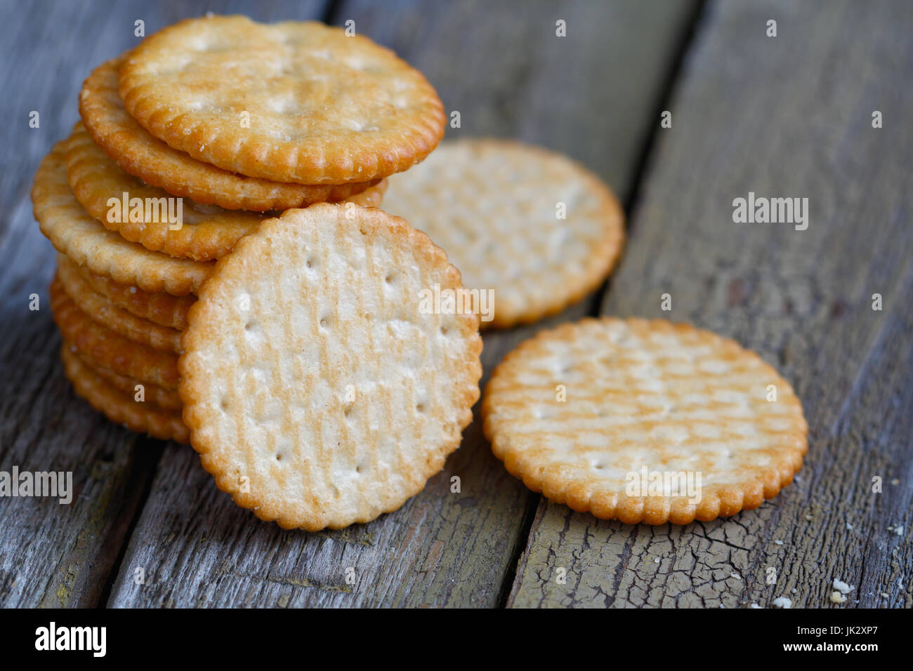 Stack of a of salted crackers on an old wooden table Stock Photo - Alamy