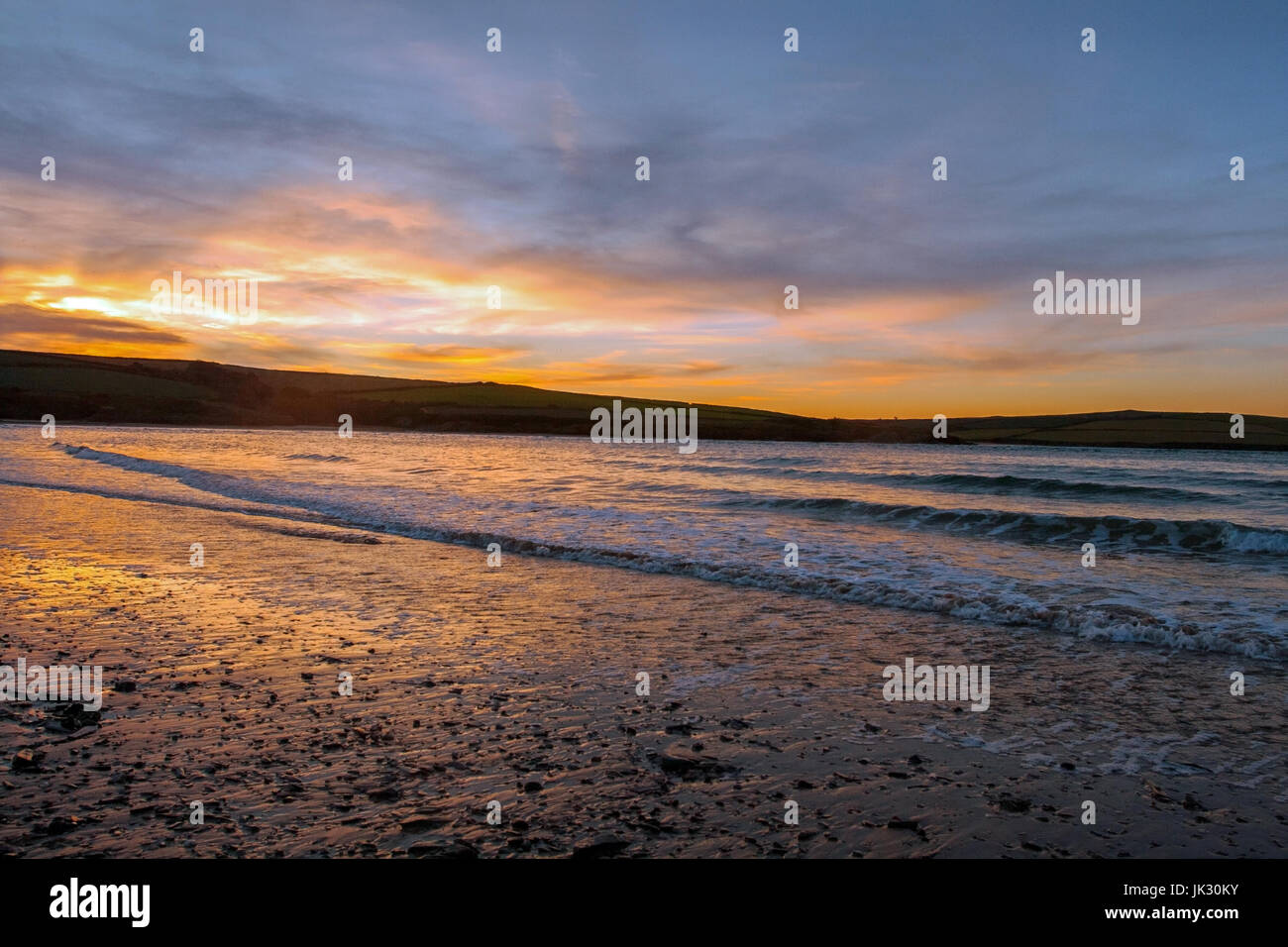 Beach scene at Sunset Stock Photo - Alamy
